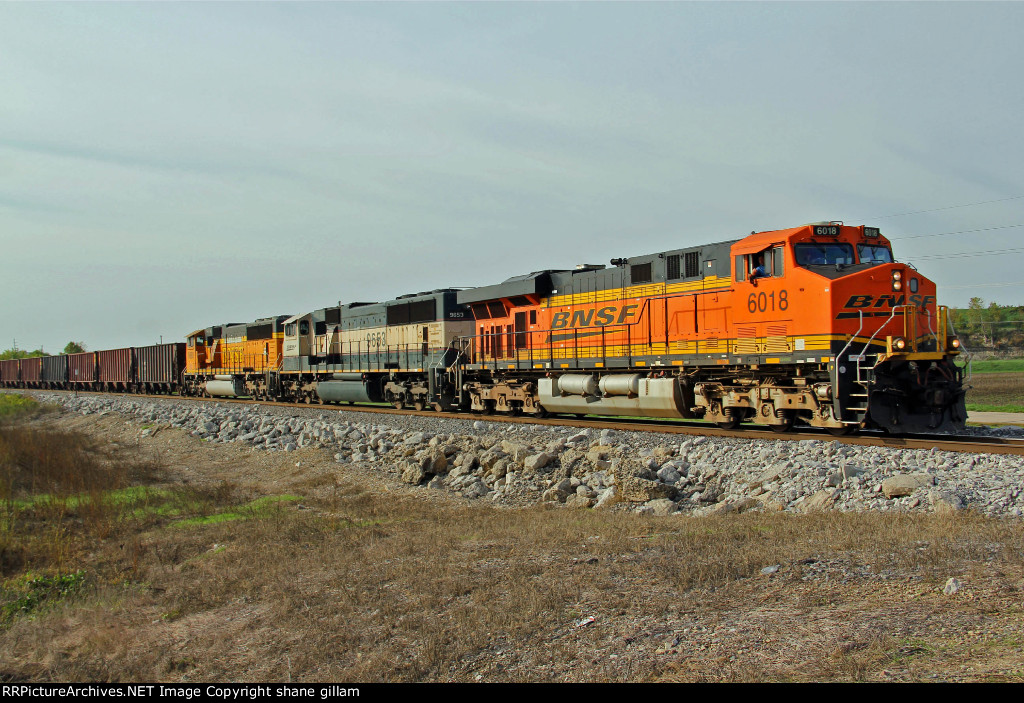 BNSF 6018 heads NB with a coal train and a good friend at the control.